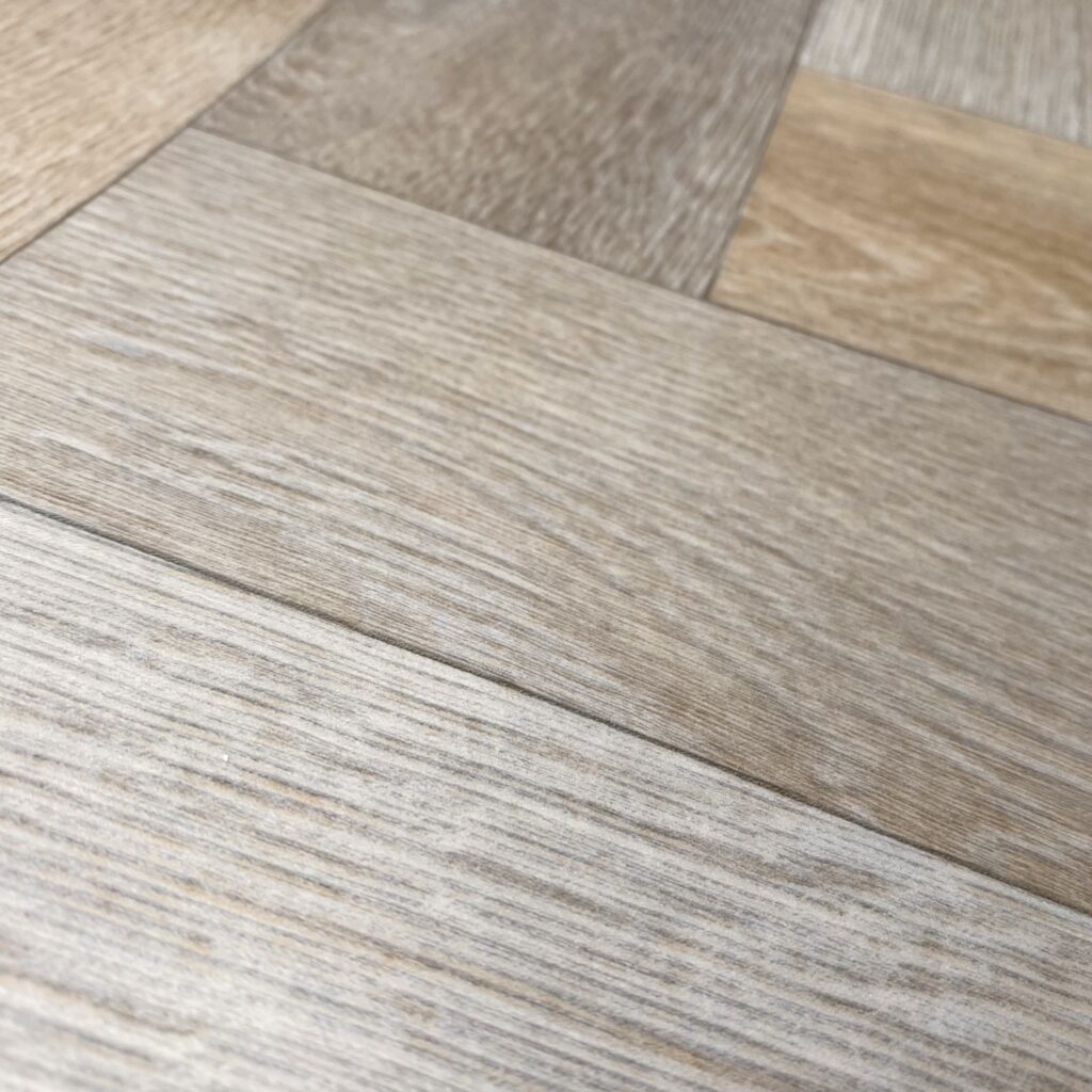 Prestige Vinyl Ancares Herringbone Grege 4m – Calverts Carpets